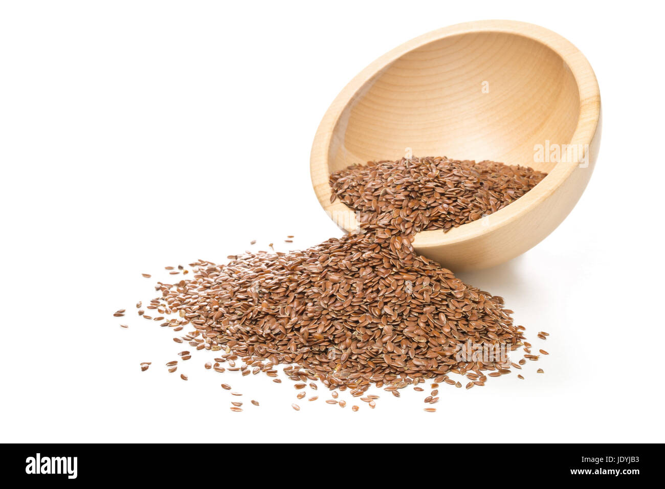 Raw, unprocessed linseed or flax seed in wooden bowl over white background Stock Photo - Alamy