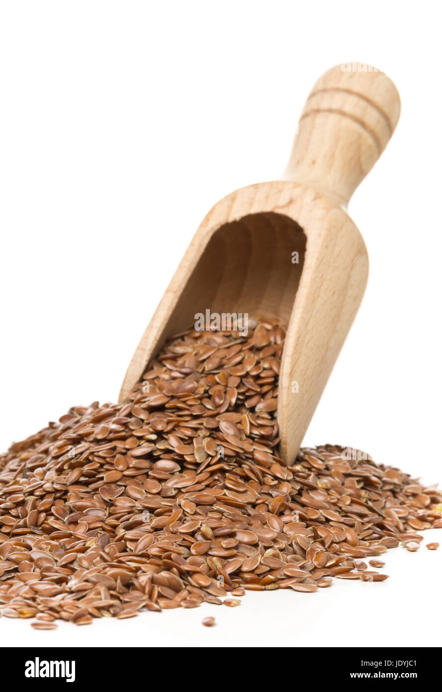 Raw, unprocessed linseed or flax seed in wooden scoop over white background Stock Photo - Alamy
