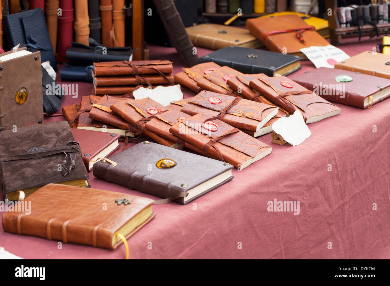 Ancient notebooks in leather over a table Stock Photo - Alamy
