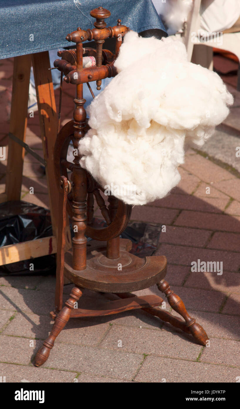 Wooden spinning wheel for weaving, on the ground Stock Photo - Alamy