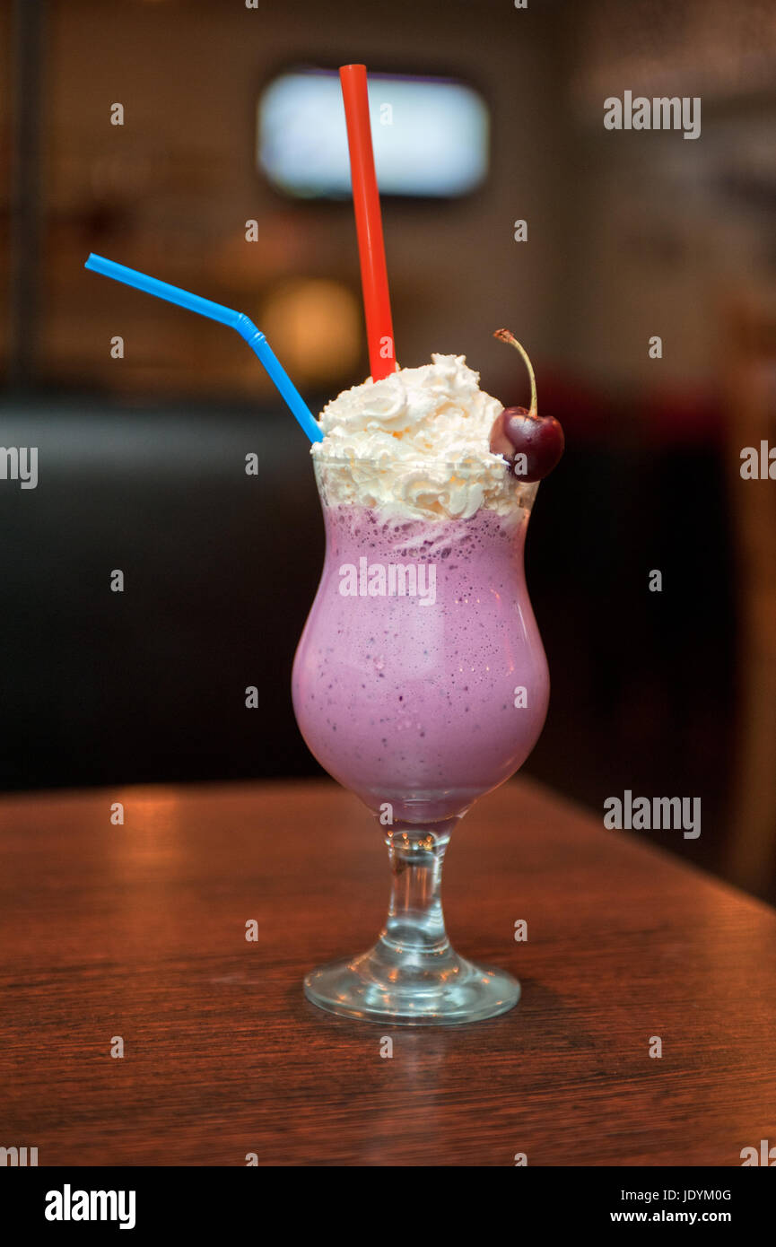 Cherry milkshake with fresh fruits Stock Photo - Alamy