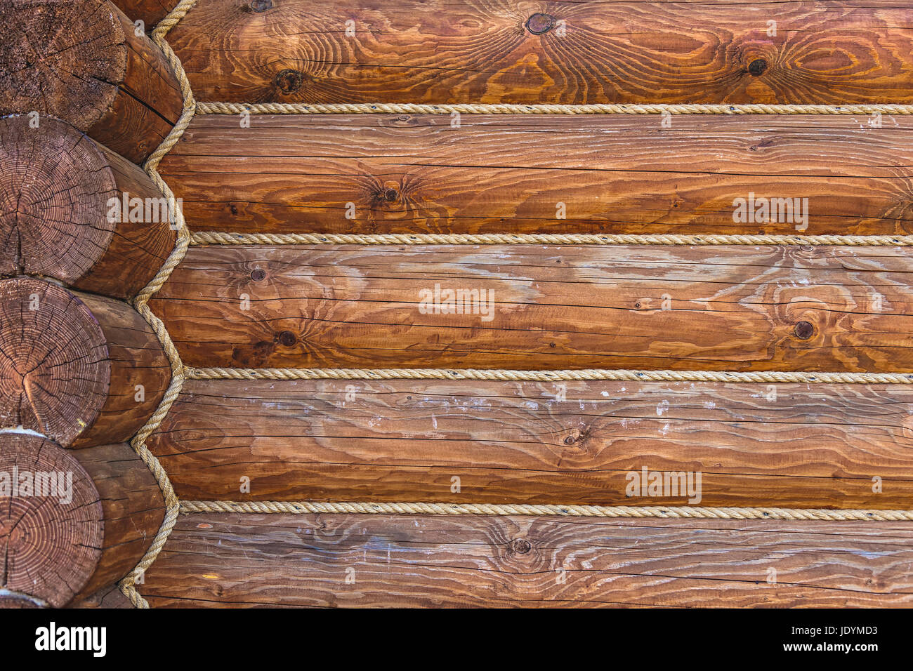 Wooden logs wall with rope of rural house background Stock Photo - Alamy