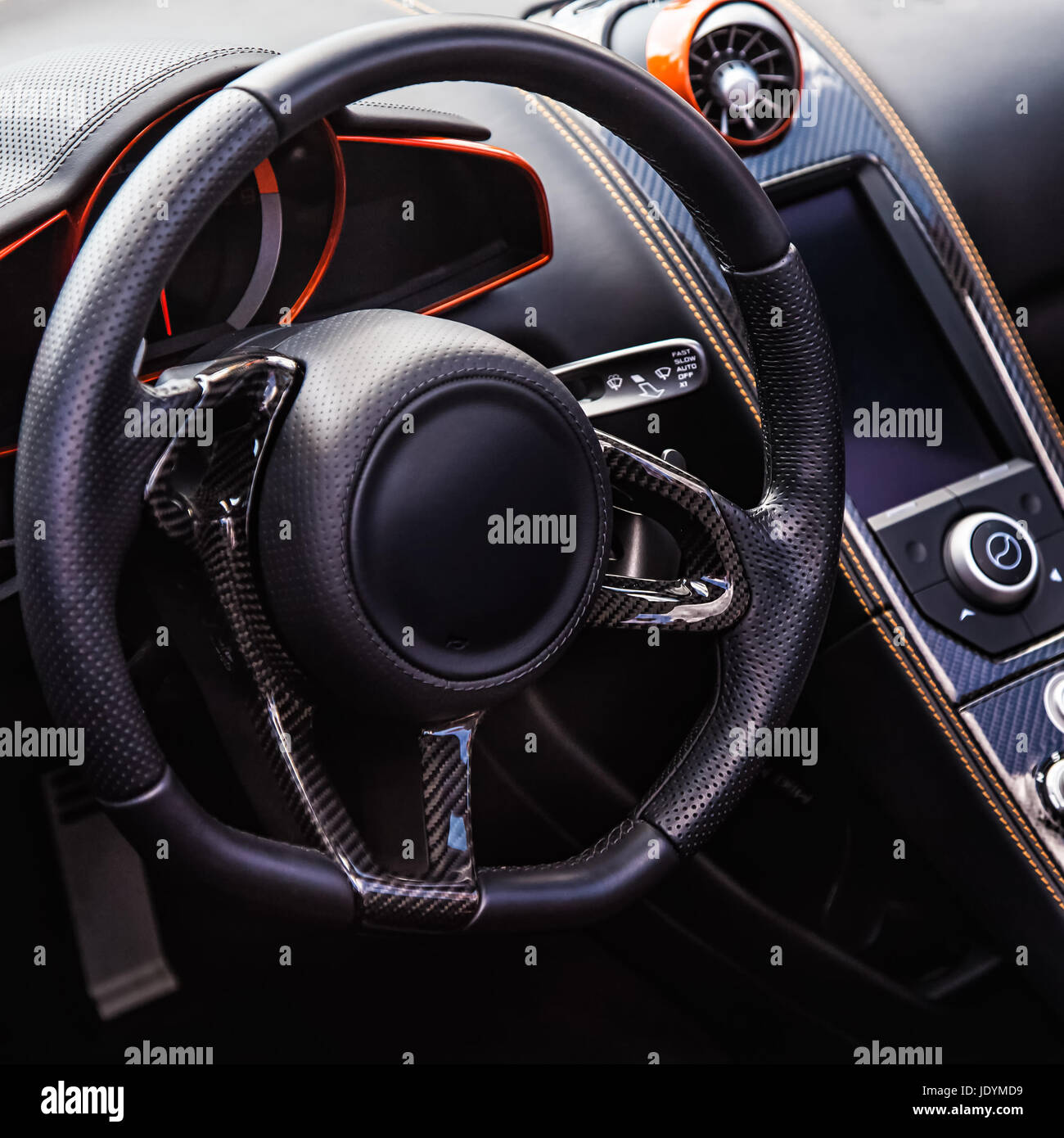 Steering wheel in interior of the sports car Stock Photo - Alamy