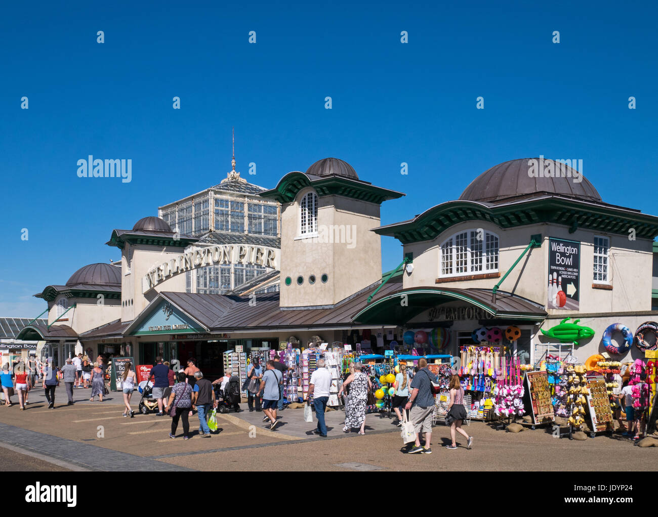 Busy Summer Seafront beside The Wellington Pier with it colourful gifts ...