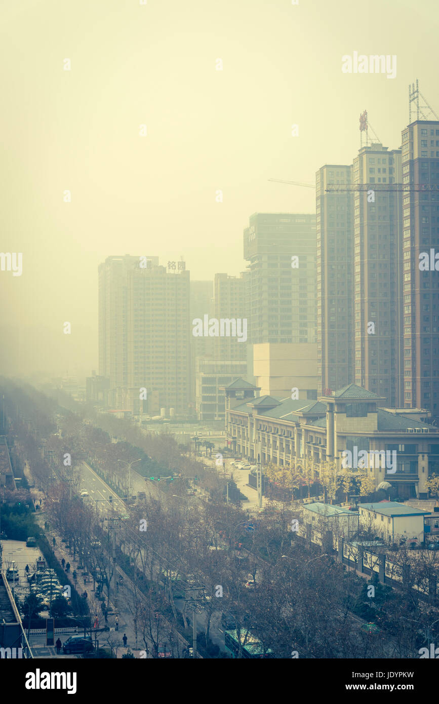 Residential suburb of high rise tower blocks in air pollution, Xian ...
