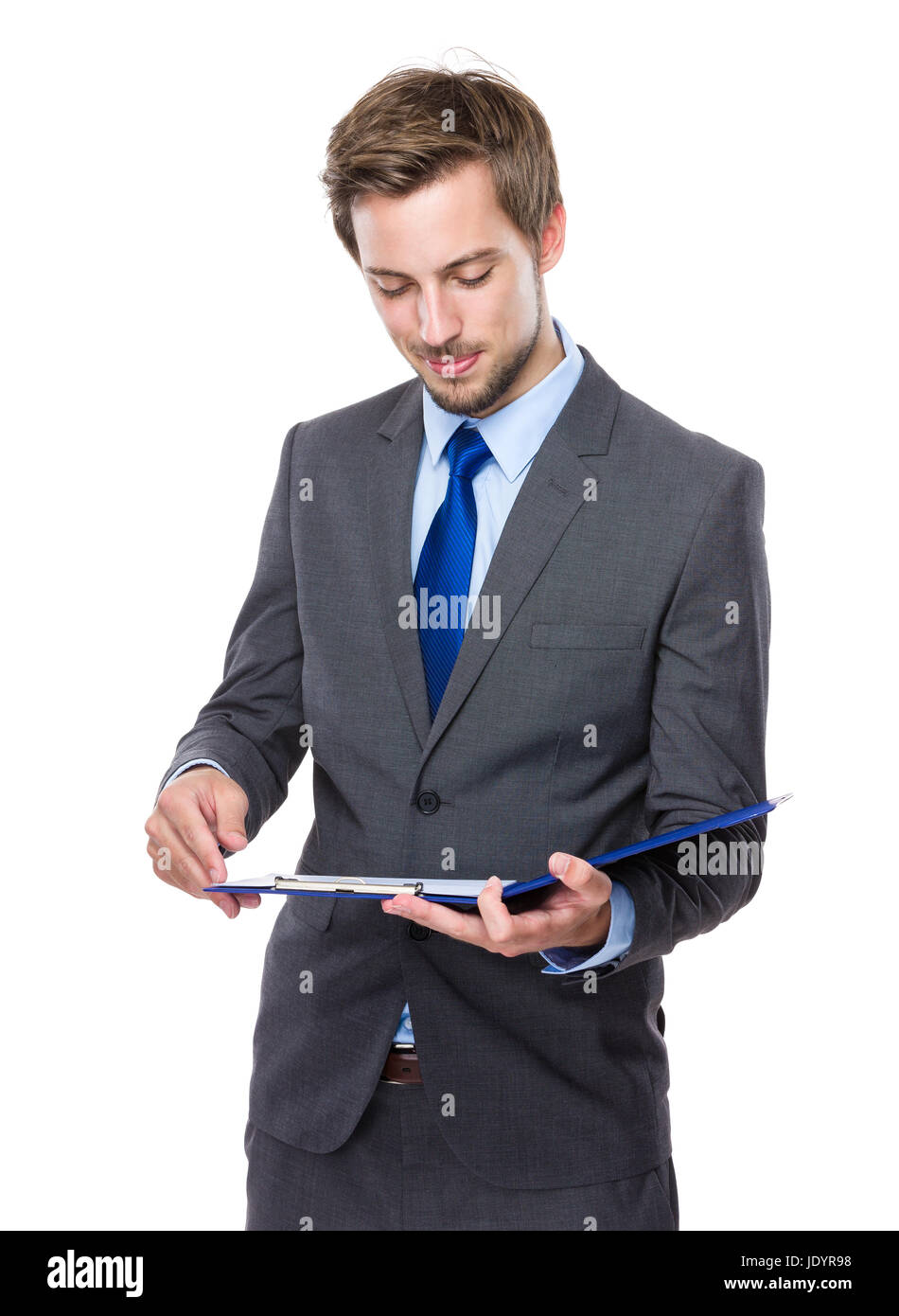 Businessman read on clipboard Stock Photo - Alamy