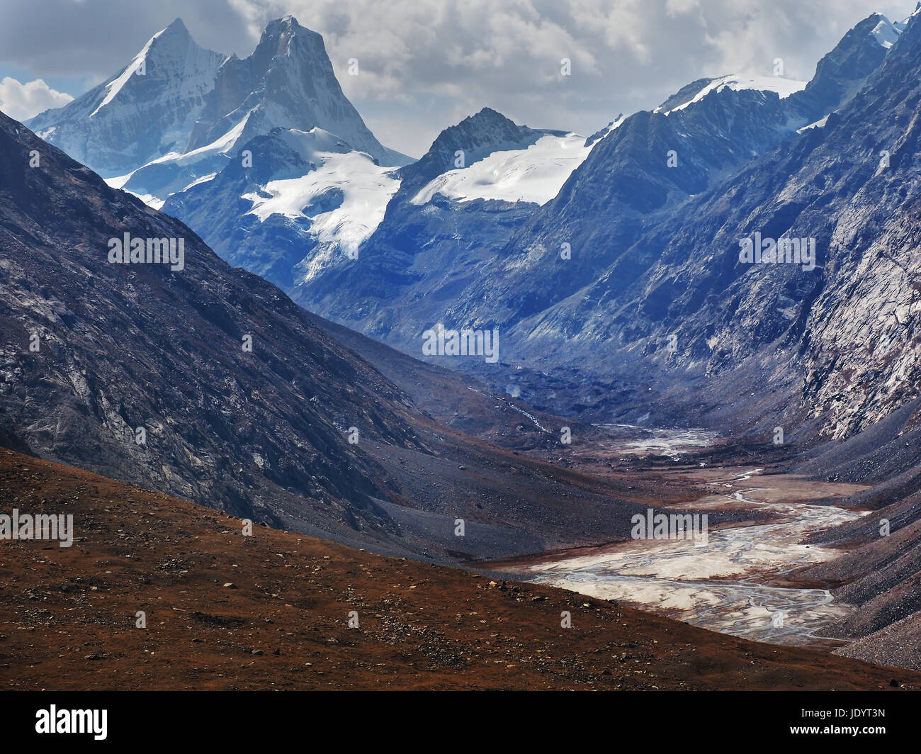 High mountains glacial valley in the Himalayas: a huge peak covered ...