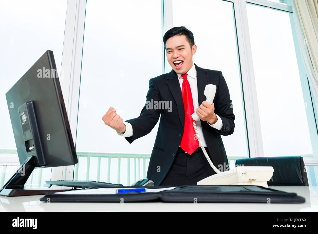Asian business man telephoning in office controlling profit Stock Photo ...