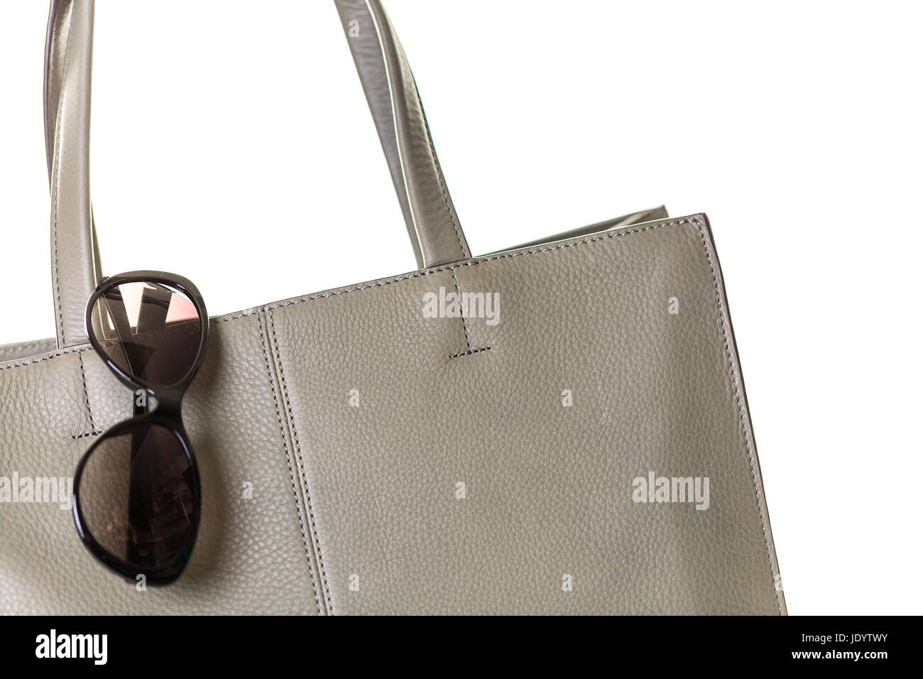 Fashionable womans leather tote with sunglasses on a white isolated ...