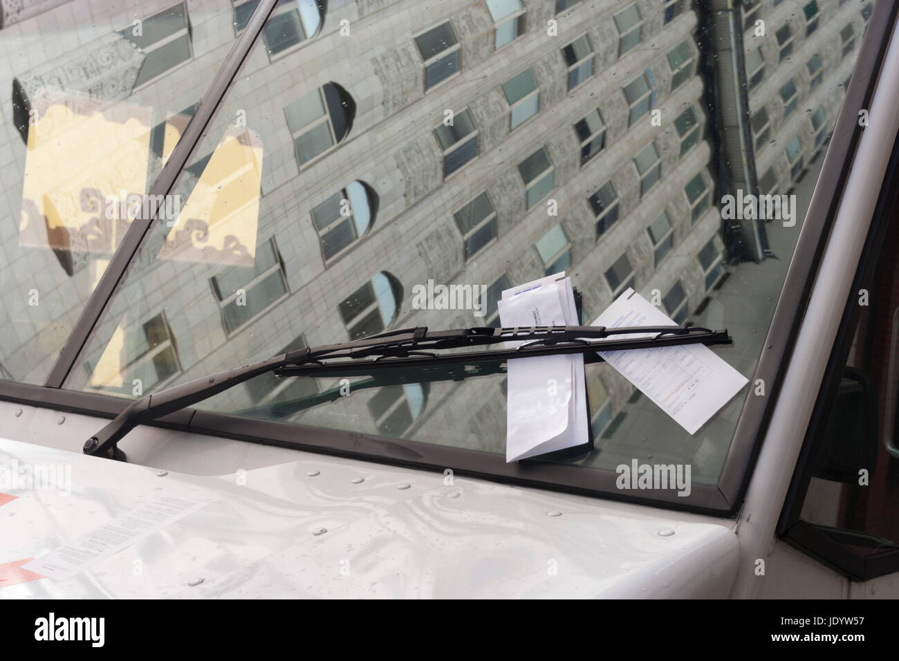 Ticket under windshield wiper hi-res stock photography and images - Alamy