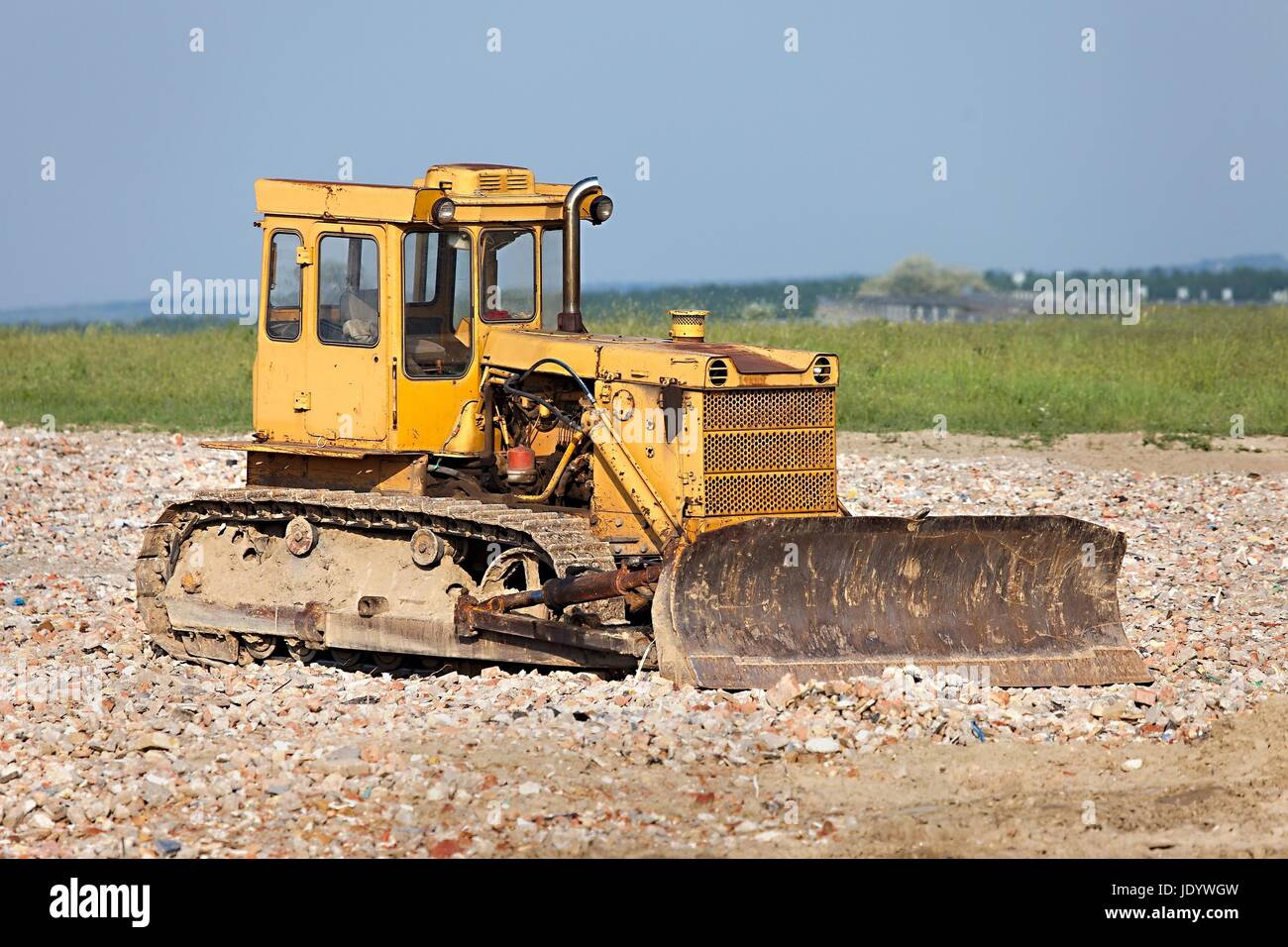 Old dozer at a construction site Stock Photo - Alamy