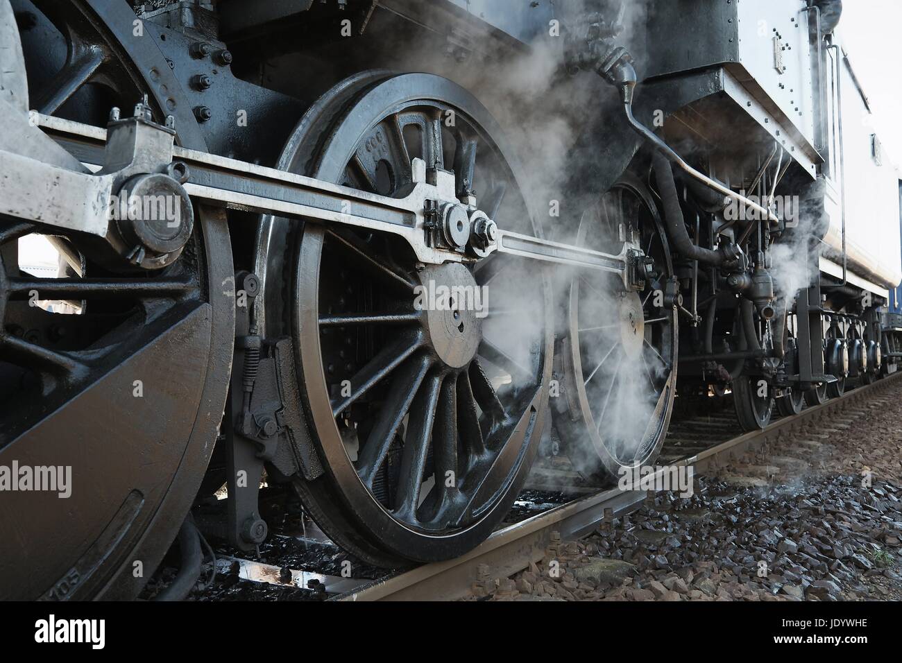 Steam locomotive rolling by close Stock Photo - Alamy