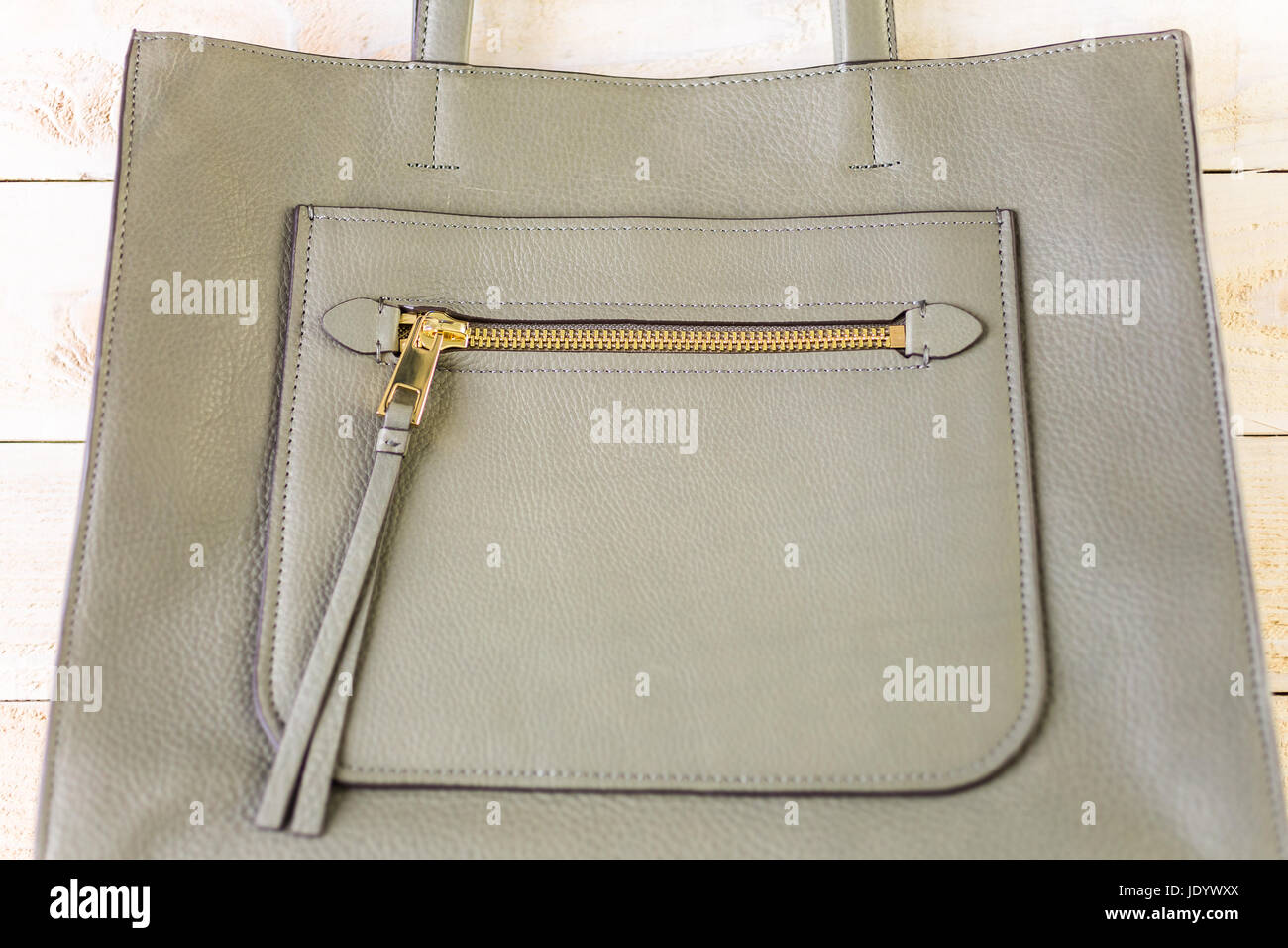 Close up of womens tote bag from gray leather Stock Photo - Alamy