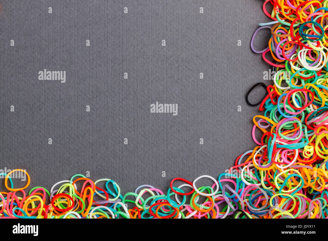Loom rubber bands frame on gray background Stock Photo - Alamy