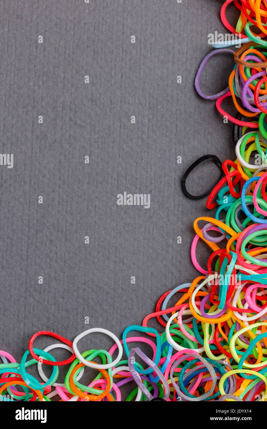 Loom rubber bands frame on gray background Stock Photo - Alamy