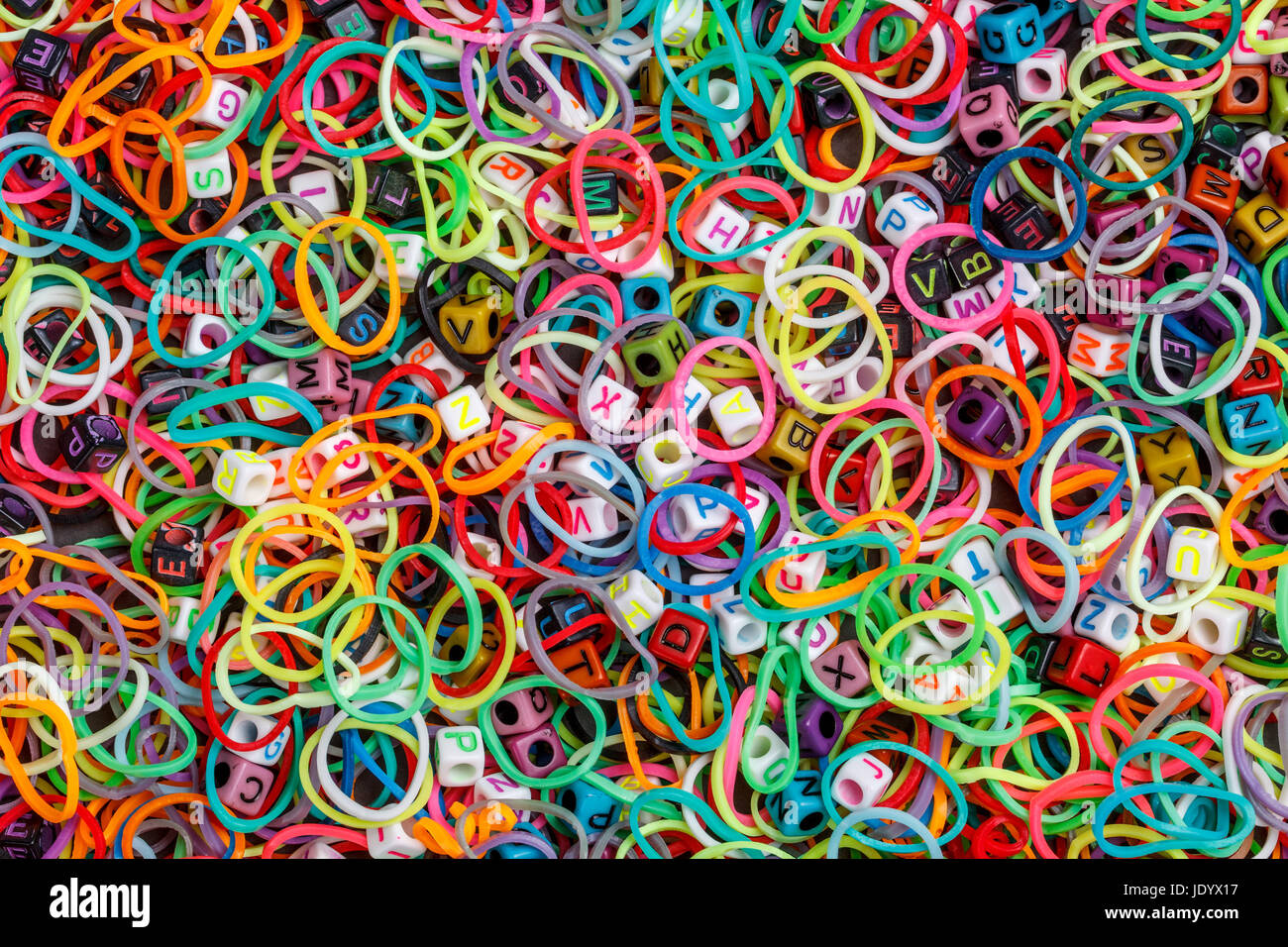 Colorful background rainbow colors rubber bands loom Stock Photo - Alamy