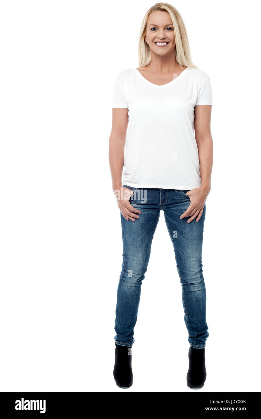 Young woman posing with hands in jeans pocket Stock Photo - Alamy