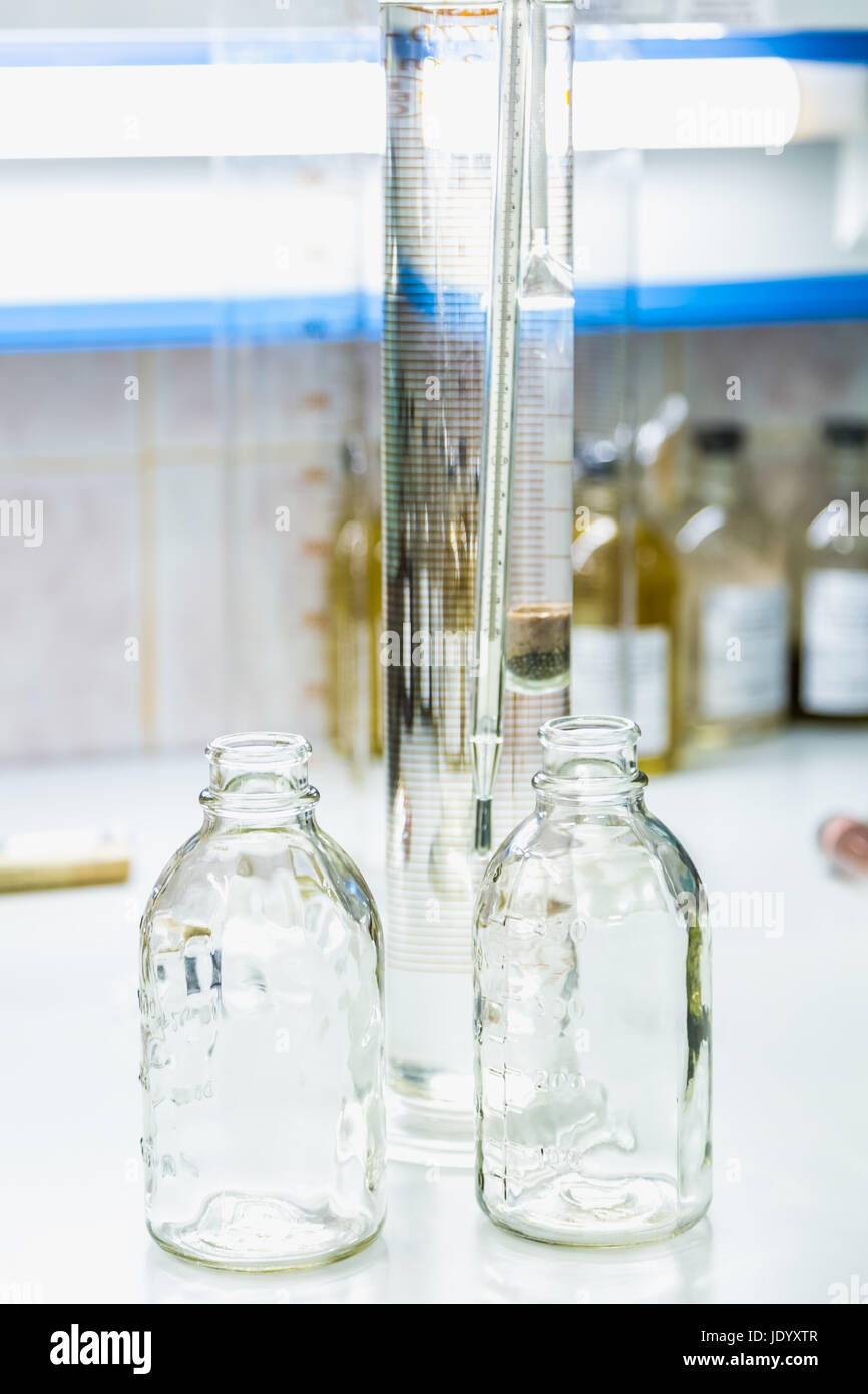 Empty glass bottles on table. Research laboratory glassware Stock Photo ...