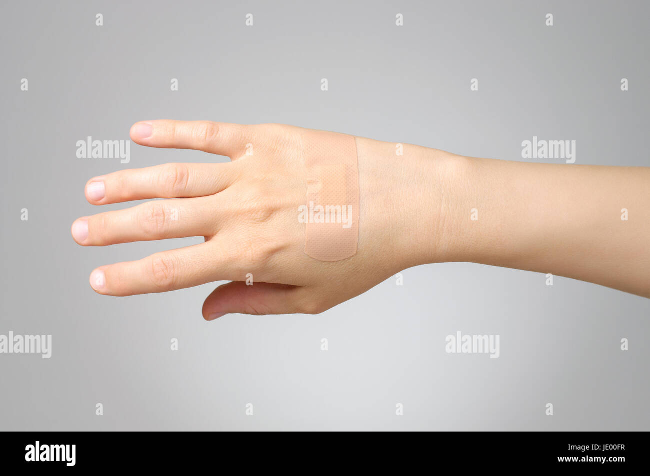 Female hand with adhesive bandage Stock Photo - Alamy
