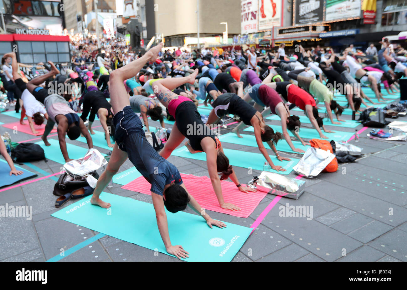 New York, USA. 21st June, 2017. Yoga fans practice yoga during a free ...