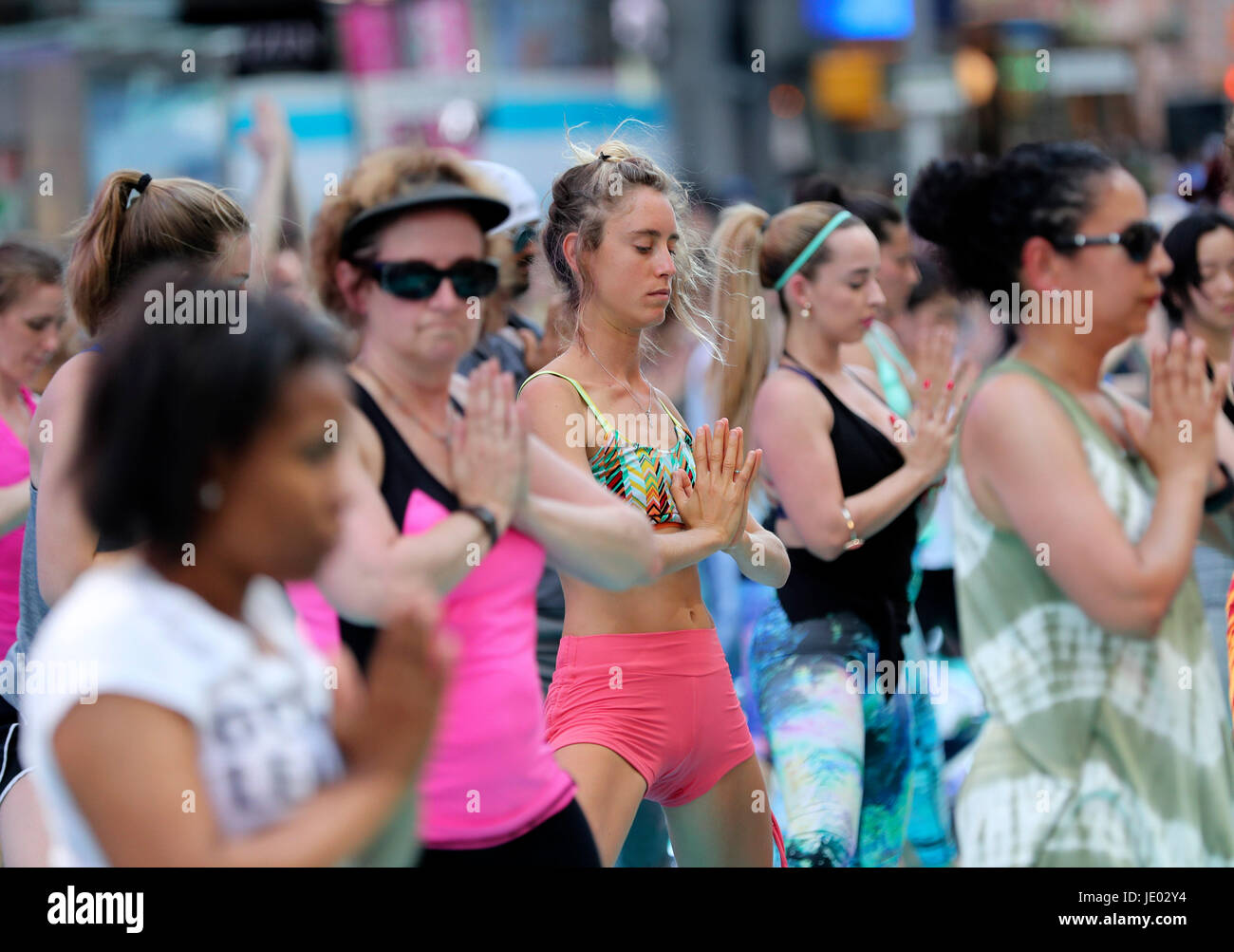 New York, USA. 21st June, 2017. Yoga fans practice yoga during a free ...