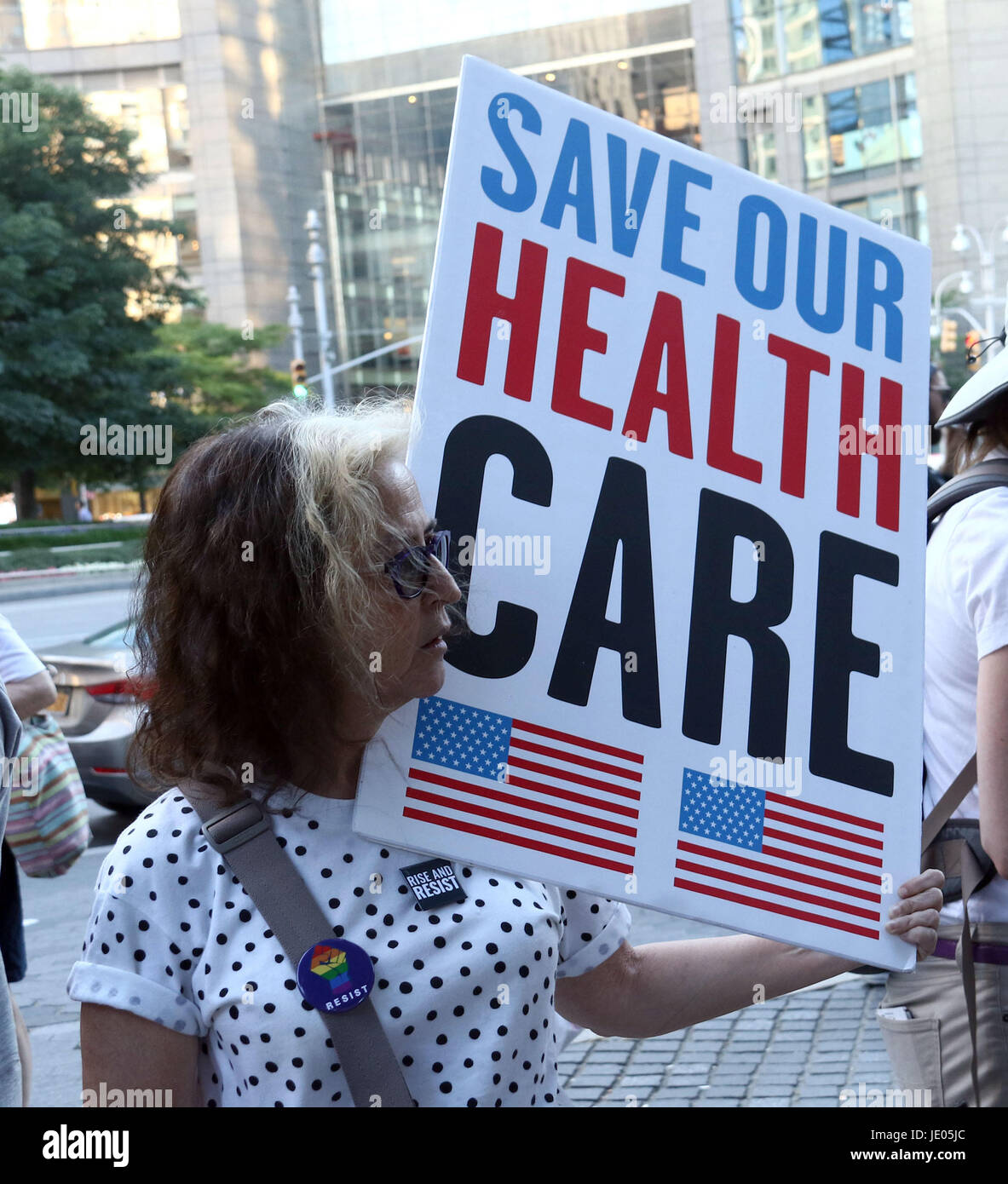 New York, New York, USA. 21st June, 2017. A health care activist holds ...