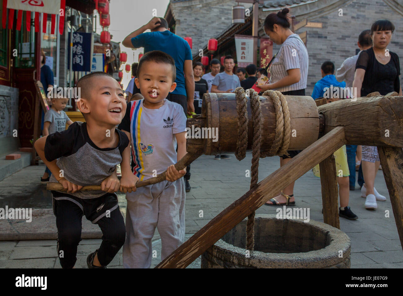 Children play well water hi-res stock photography and images - Alamy