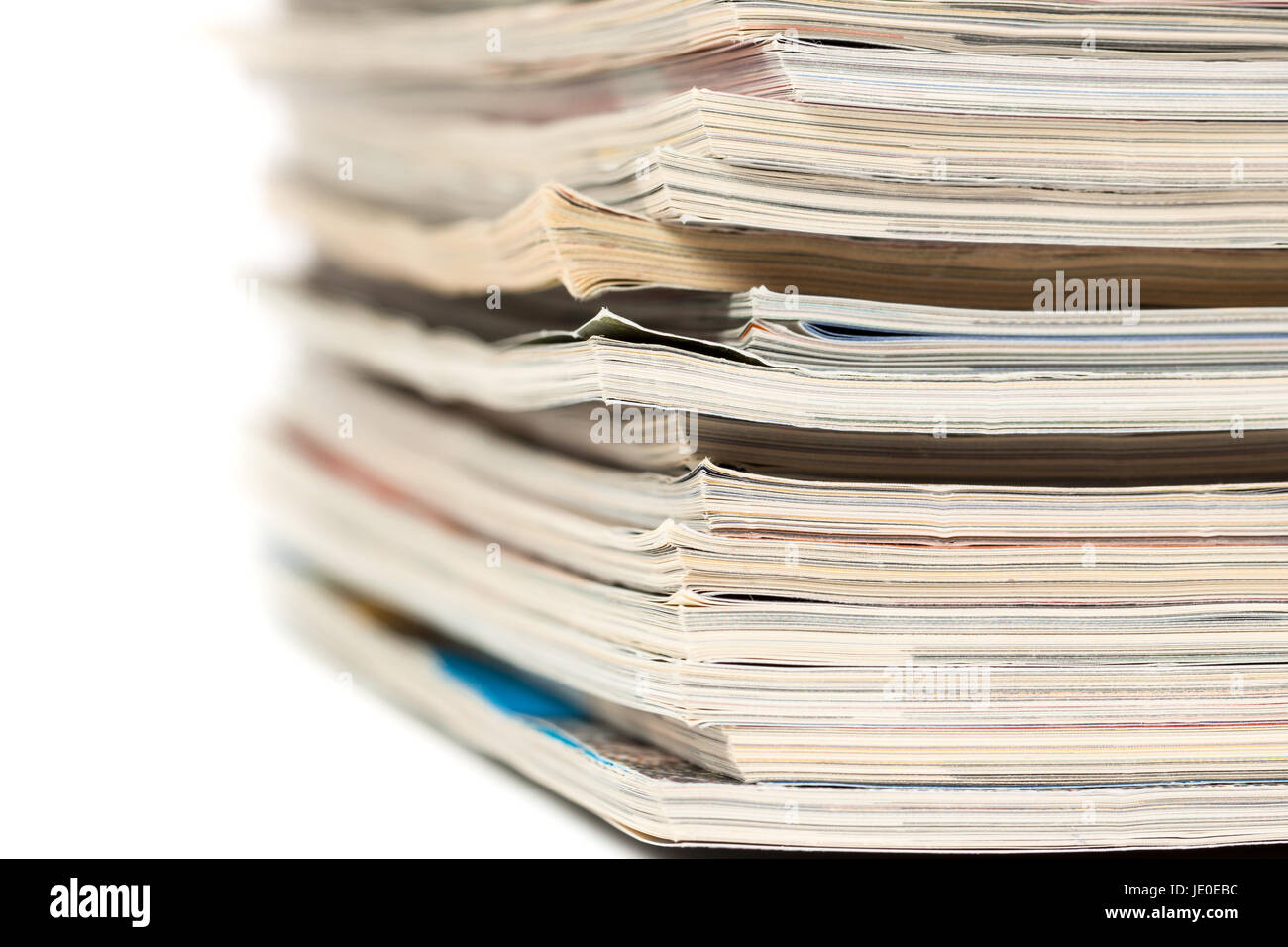 Colorful magazines up close shot on white background Stock Photo - Alamy