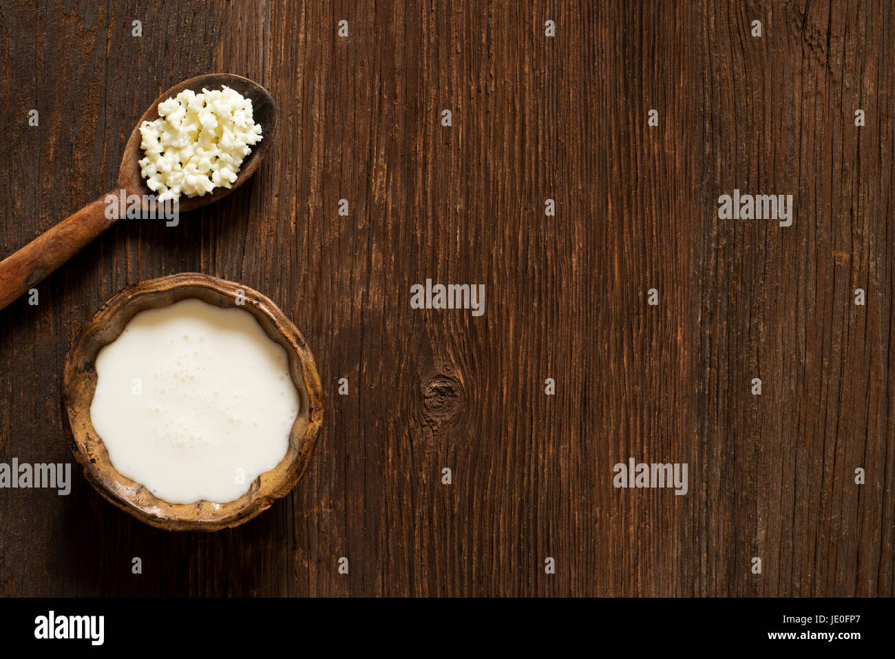 Milk kefir grains on a wooden spoon overhead shoot Stock Photo - Alamy