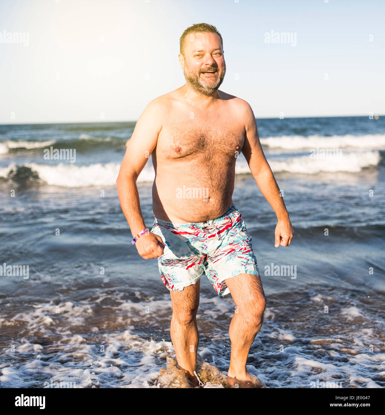 Happy man on the beach Stock Photo - Alamy