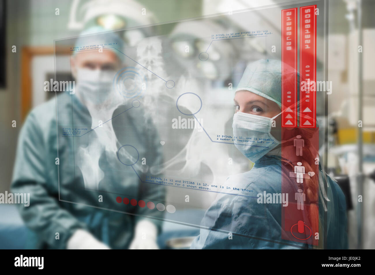 Surgeons checking holographic x-ray display in red Stock Photo - Alamy