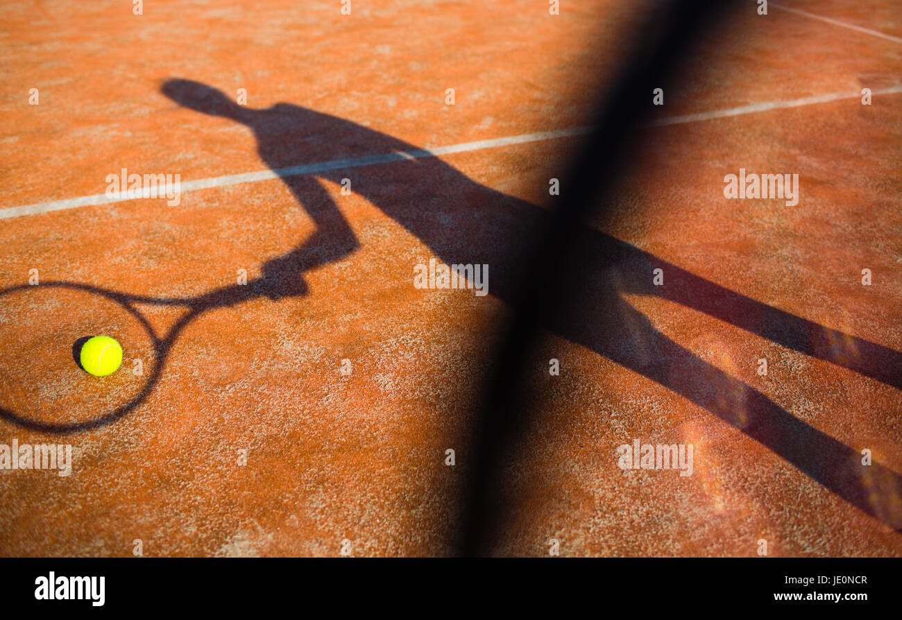 Shadow of a tennis player in action on a tennis court (conceptual image ...