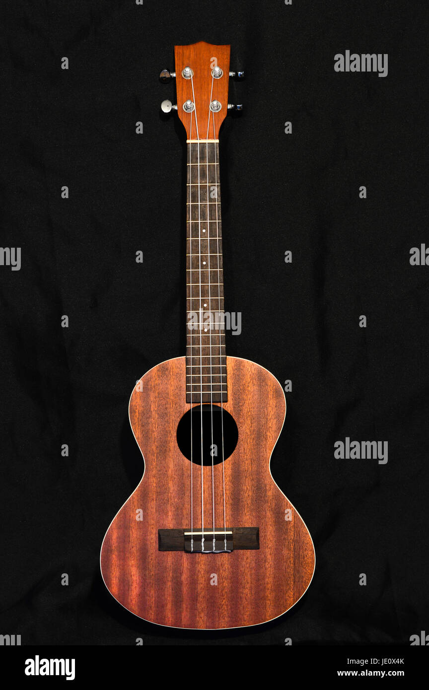 ukulele body with cut away and gray background Stock Photo - Alamy
