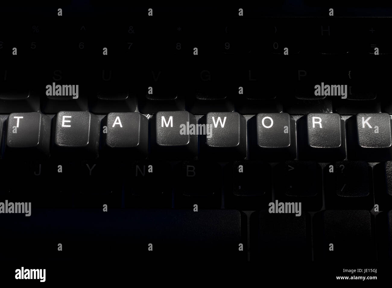 Pc computer keyboard with the keys arranged to spell the word teamwork ...