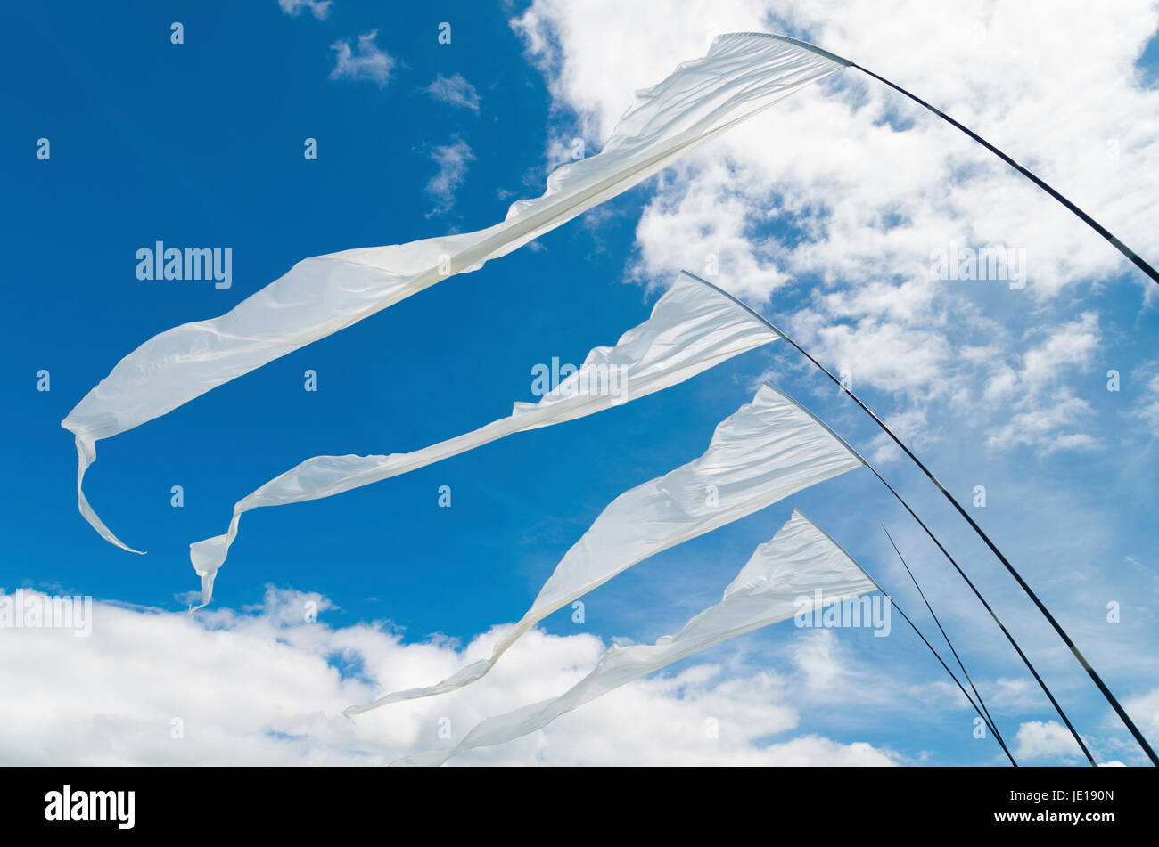 white kite flags waving in the wind Stock Photo - Alamy