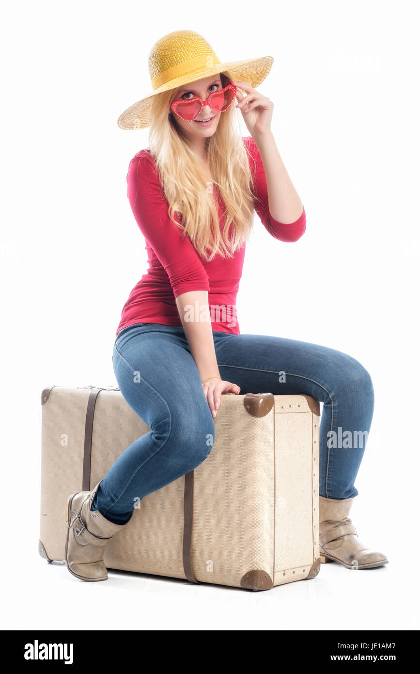 woman sitting on suitcase Stock Photo - Alamy