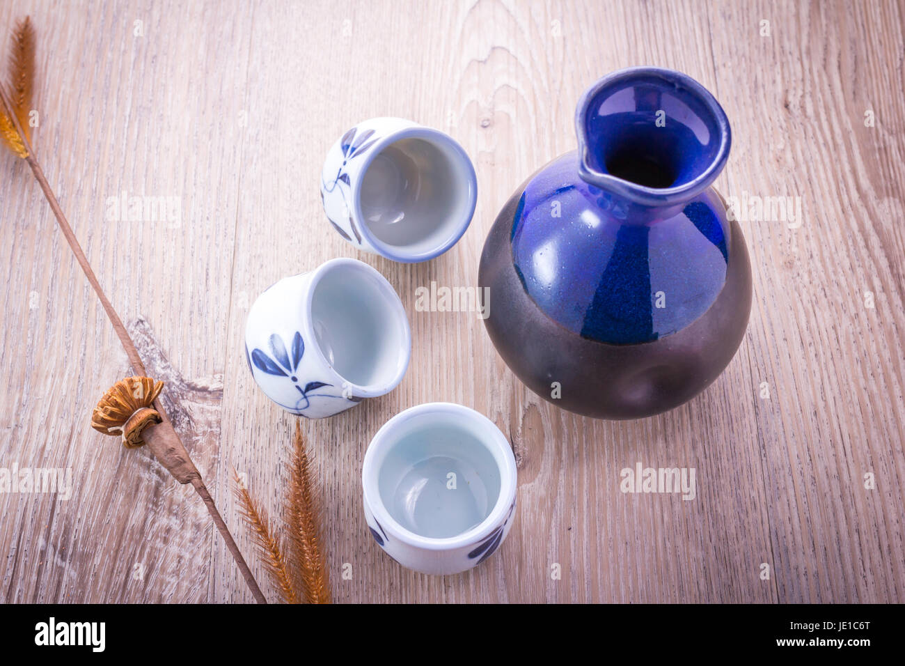Japanese Sake drinking set on old wood texture background Stock Photo ...