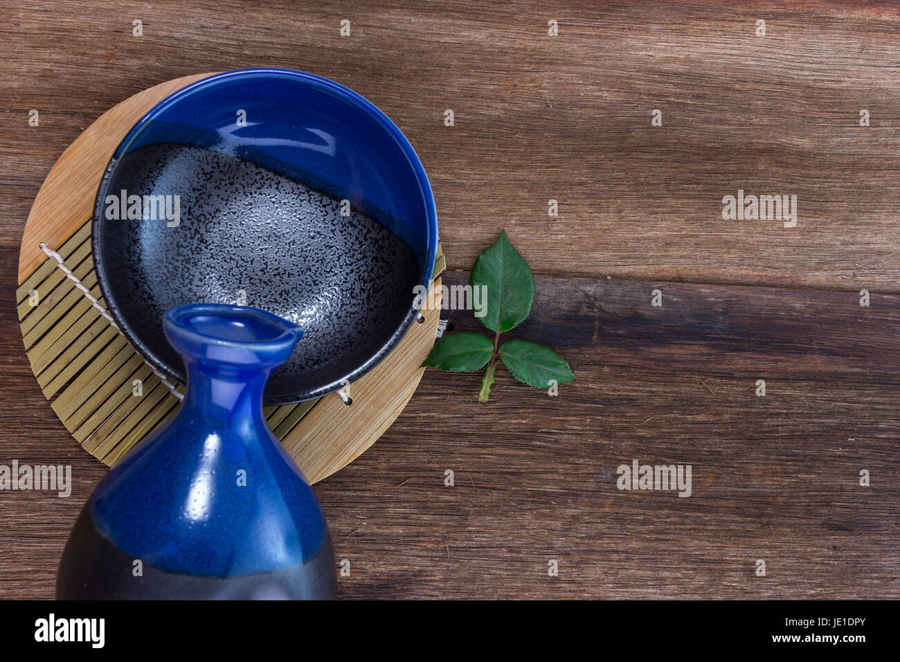 Japanese Sake drinking set on old wood texture background Stock Photo ...