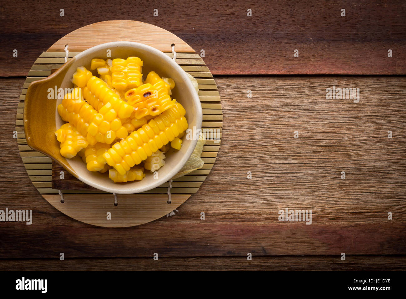 split corn on wood background, View from above with copy space Stock ...