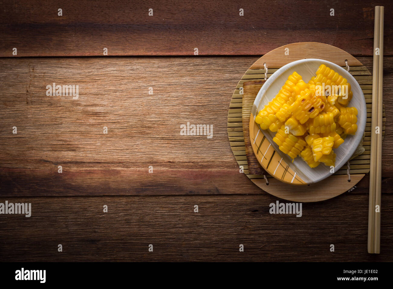 split corn on wood background, View from above with copy space Stock ...
