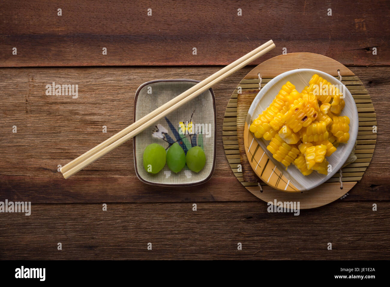 split corn on wood background, View from above with copy space Stock ...