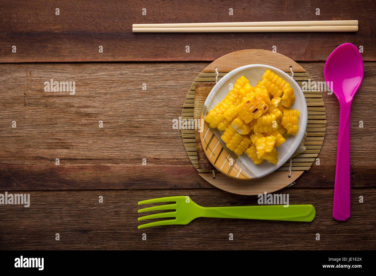 split corn on wood background, View from above with copy space Stock ...