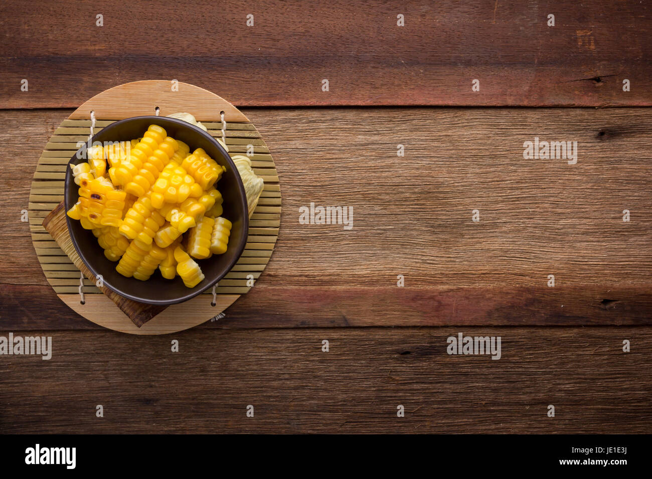 split corn on wood background, View from above with copy space Stock ...