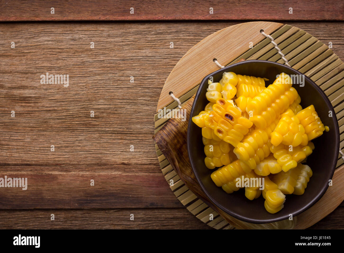 split corn on wood background, View from above with copy space Stock ...