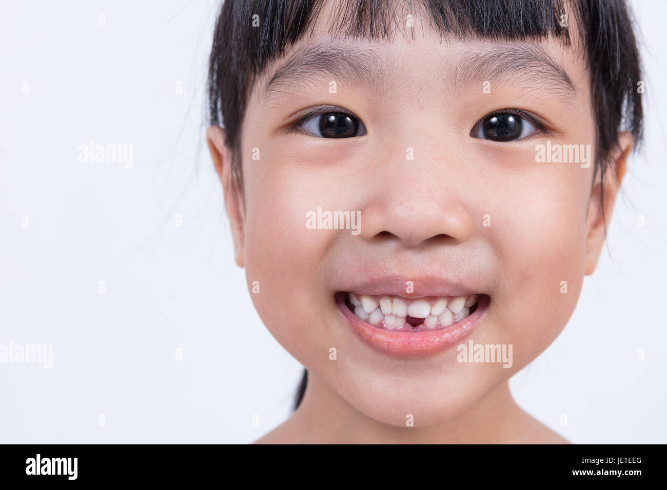 Happy Asian Chinese little girl with toothless smile in isolated white ...