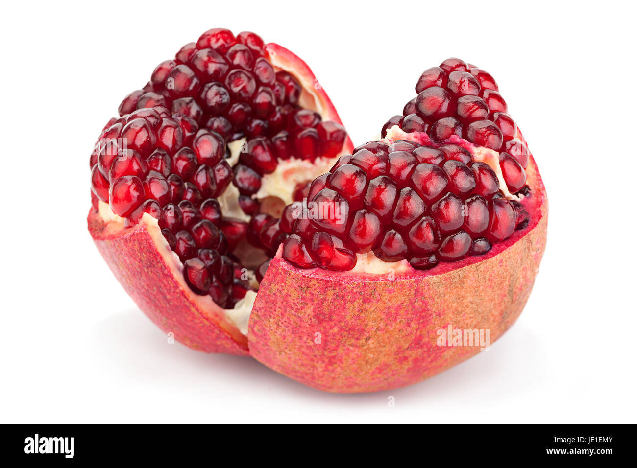 Pomegranate fruit closeup isolated on white background Stock Photo - Alamy