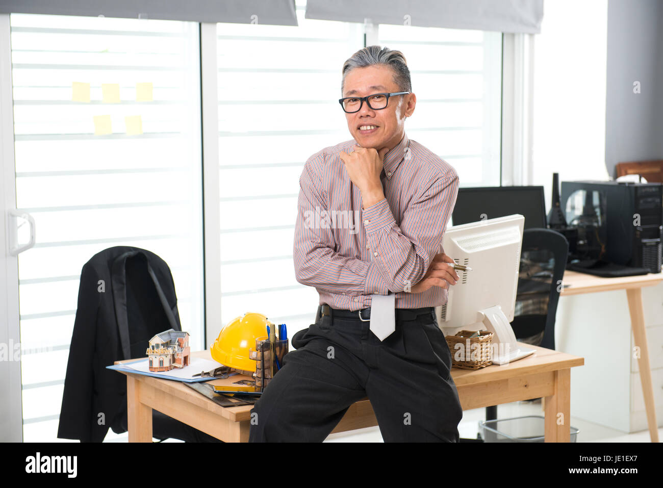 senior asian male at work Stock Photo - Alamy