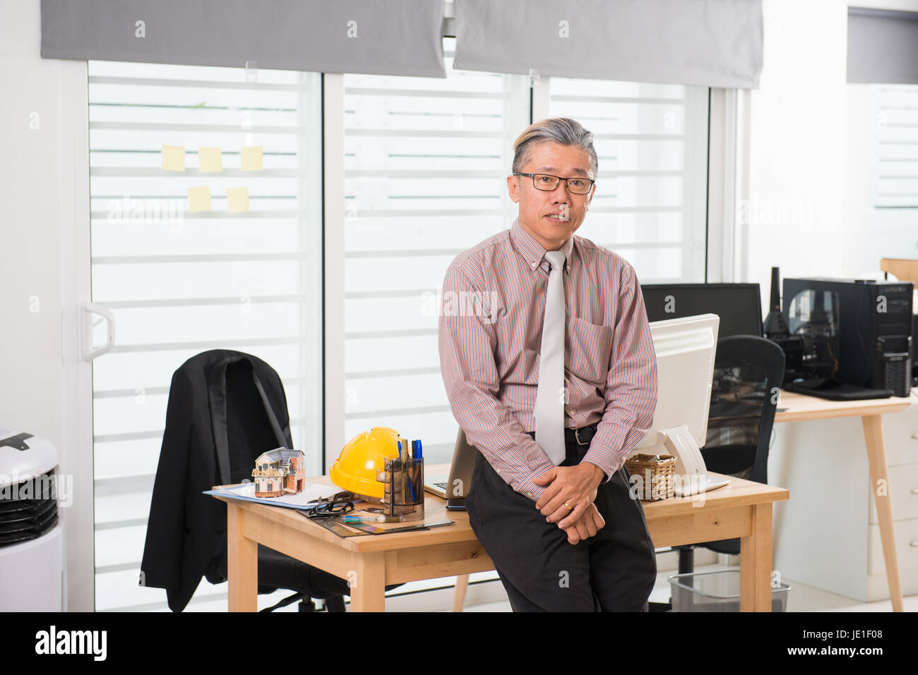 senior asian male at work Stock Photo - Alamy