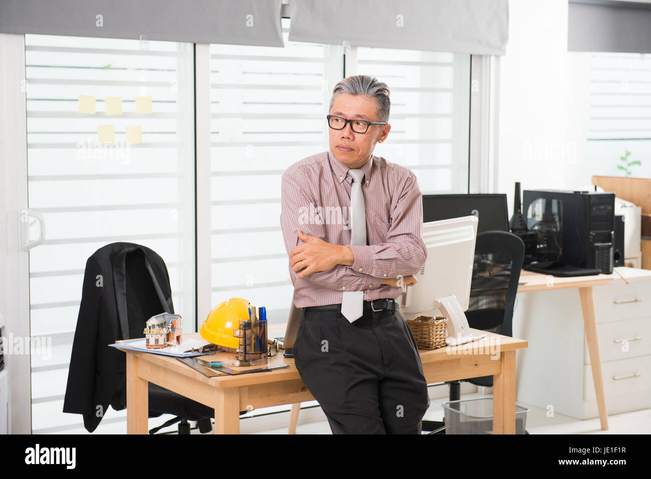 senior asian male at work Stock Photo - Alamy