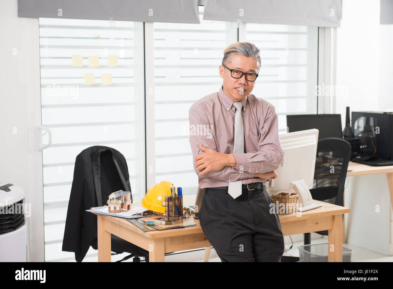 senior asian male at work Stock Photo - Alamy